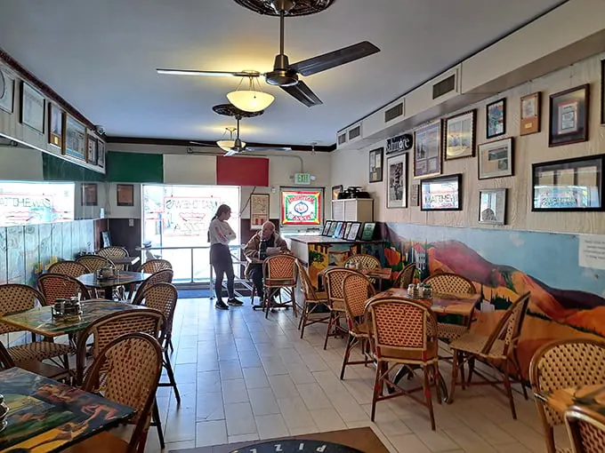 Step into a time capsule of flavor! This cozy interior is where pizza dreams come true, with wicker chairs that have witnessed decades of delicious memories.