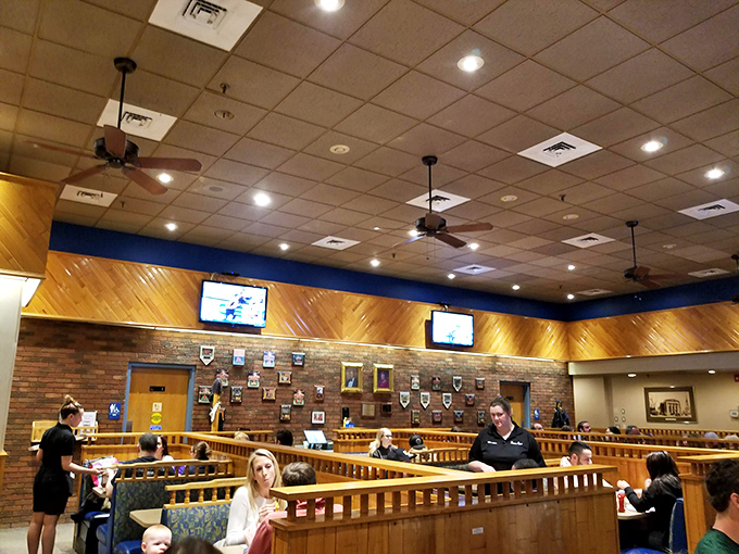 Step into a time capsule of comfort and nostalgia. The wood paneling and cozy booths whisper, "Stay awhile, and have another slice."