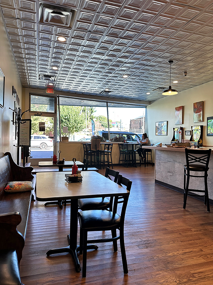 That pressed tin ceiling isn't just gorgeous—it's witnessed decades of morning conversations, coffee refills, and the quiet satisfaction of perfectly cooked eggs.