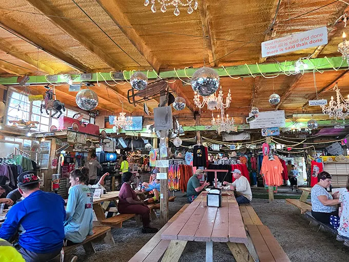 Disco balls and chandeliers? It's like your eccentric aunt's attic threw a party with a barbecue pit. This interior screams "come as you are" – and come hungry!