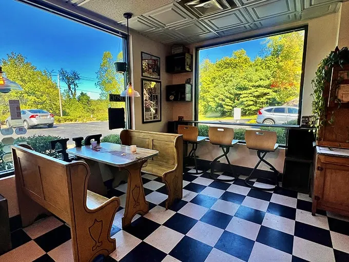 Step into a time machine of taste! The retro-chic interior, complete with checkered floors and church pew seating, sets the stage for a delightful culinary journey.