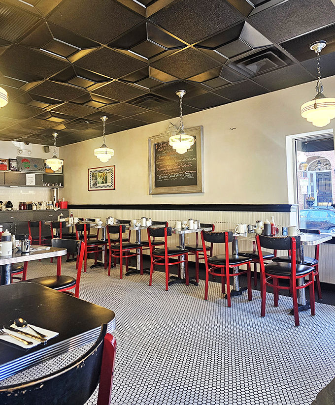 Step into a time machine disguised as a diner. The geometric ceiling and retro lighting set the stage for a meal that's both nostalgic and delicious.
