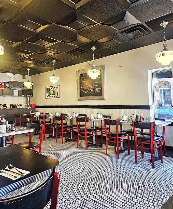 Step into a time machine disguised as a diner. The geometric ceiling and retro lighting set the stage for a meal that's both nostalgic and delicious.