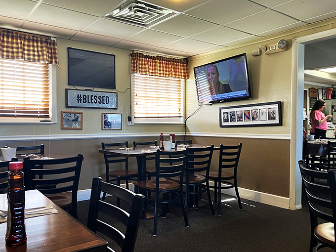 Cozy vibes and checkered curtains? Check! This diner's interior is like a warm hug from your favorite aunt – if she were really into planes.
