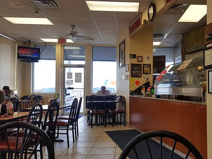 Step into a time capsule of classic Americana. This no-frills interior whispers tales of satisfied customers and burger-fueled road trips.