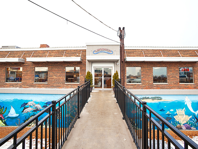 Lawrence's Fish & Shrimp: The late-night hero we deserve! That giant shrimp sign isn't compensating – it's a promise of colossal flavor.
