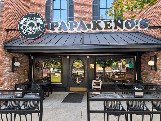 The brick facade of Papa Keno's—where college students and professors alike find common ground in pizza appreciation.