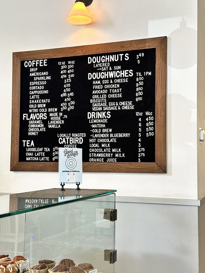 This menu board isn't just listing options—it's showcasing a donut philosophy. Doughwiches until 1PM? Clear your schedule accordingly.