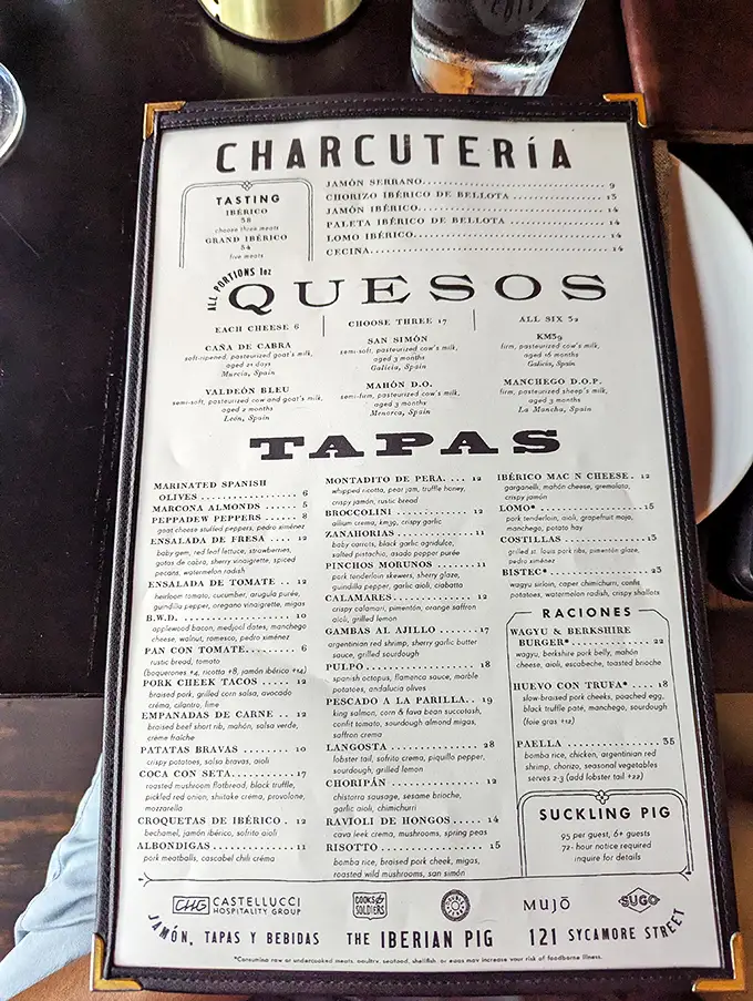 The menu reads like a love letter to Spanish cuisine—each description promising flavors worth crossing the Atlantic for.