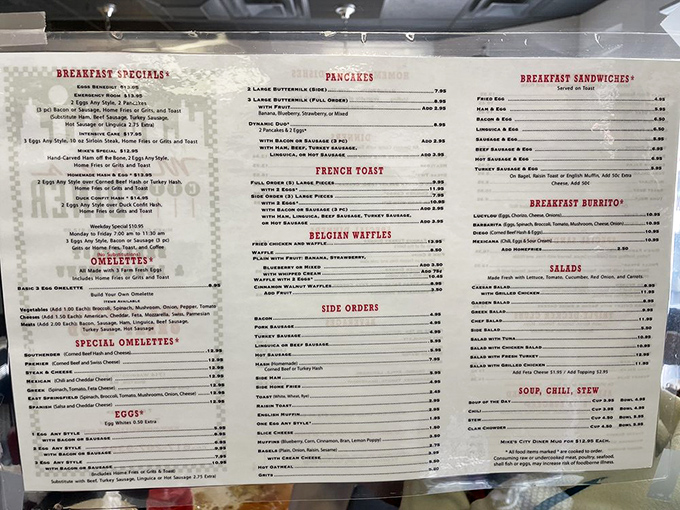 A menu that reads like a love letter to breakfast. From "Hungry Man" to "Belgian Waffles," each item promises a culinary adventure.