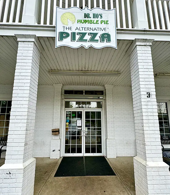 That white porch at Dr. Ho's isn't just architectural charm—it's where pizza dreams and afternoon breezes become best friends.