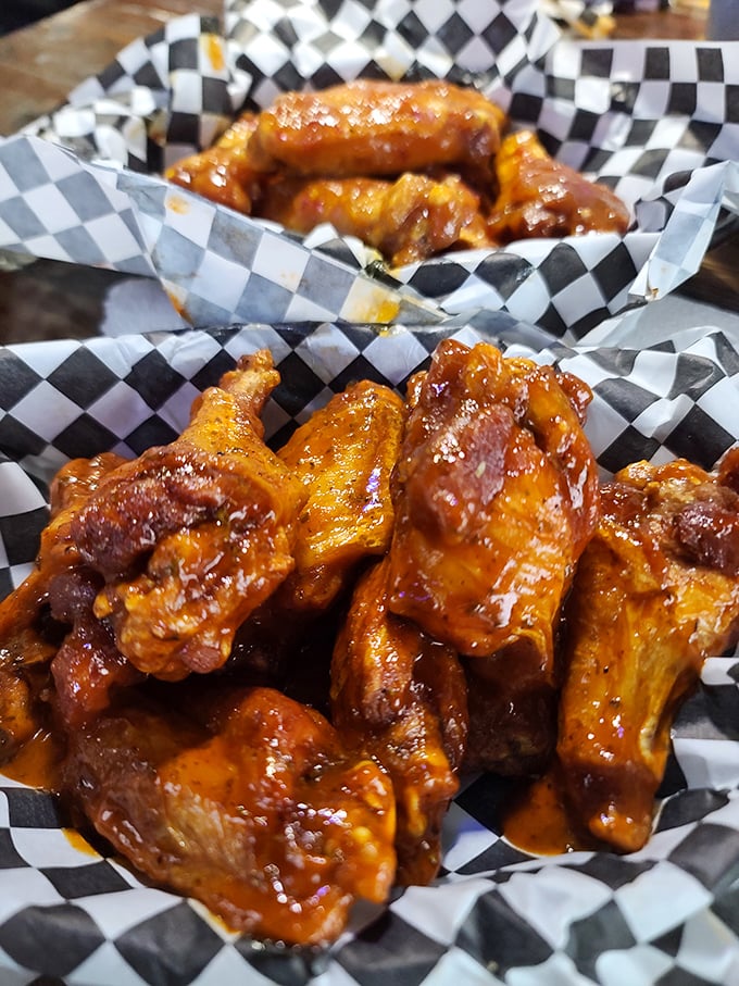 These wings aren't just sauced—they're baptized. The checkered paper basket barely contains the glory of what might be Virginia's most authentic Buffalo experience.