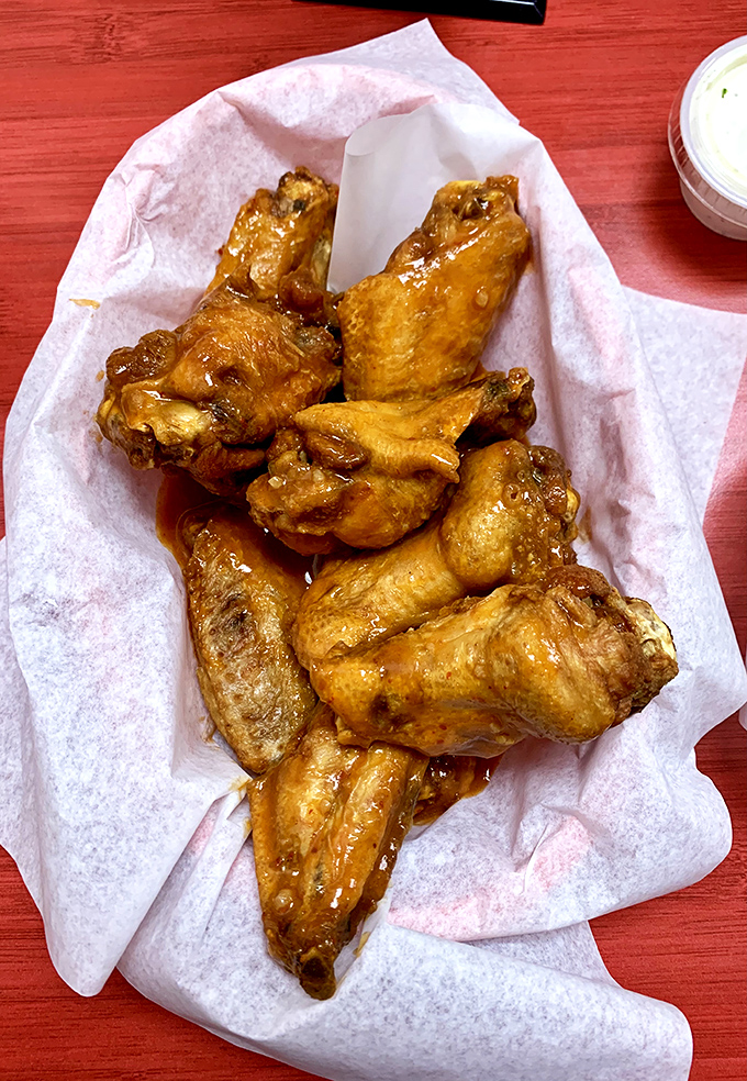 Golden, glistening, and ready for their close-up. These wings are so photogenic, they could star in their own food network show.