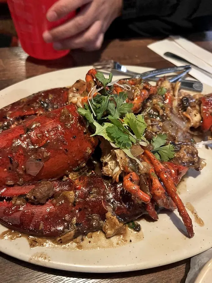 Holy crab legs, Batman! This Cantonese-style lobster looks ready to crawl right off the plate and into seafood legend.