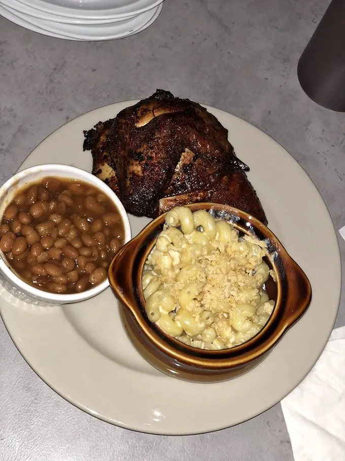 This plate tells the whole story – smoky chicken with a perfect bark, baked beans that didn't come from any can, and mac and cheese that deserves its own fan club.