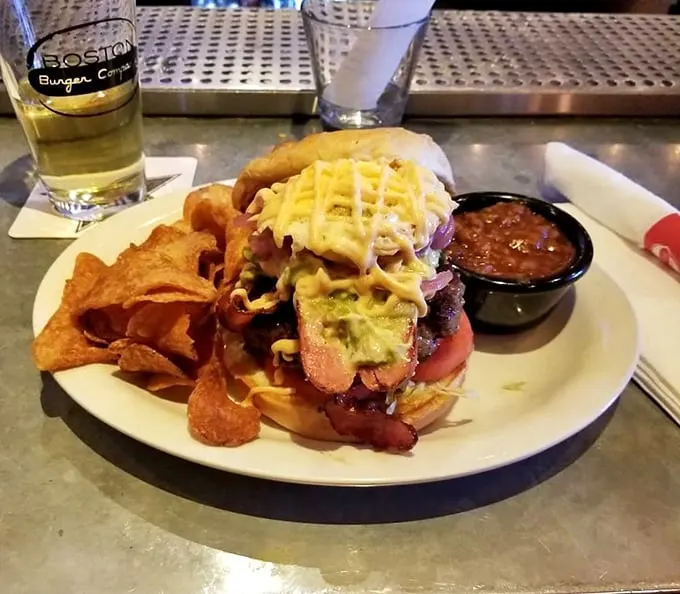 This isn't just a cheeseburger; it's a tower of flavor that would make the Leaning Tower of Pisa stand up straight with envy.
