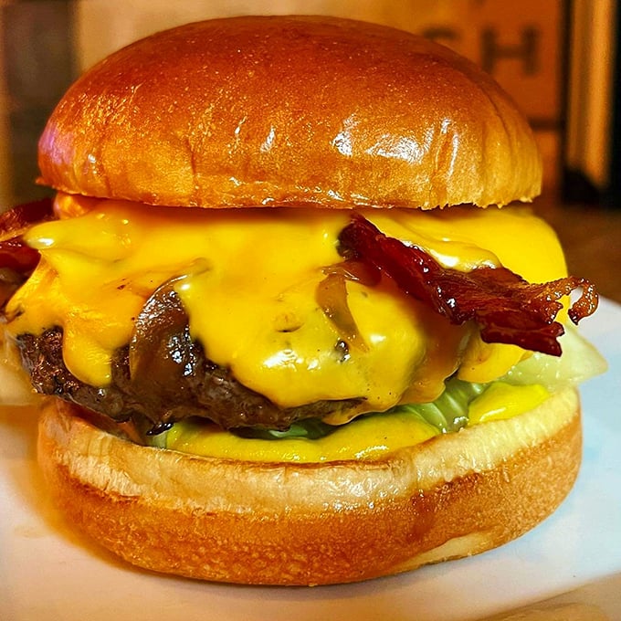Behold, the burger of your dreams! This cheesy masterpiece is so photogenic, it could have its own Instagram account.