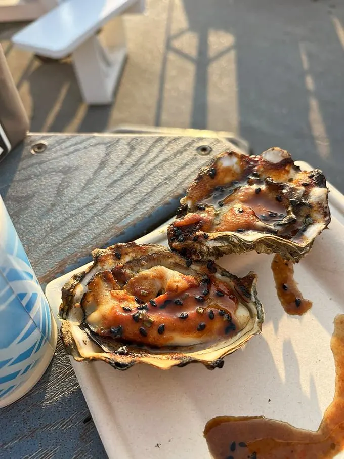 These grilled oysters aren't just food; they're edible works of art. Smoky, briny, and oh-so-buttery – it's like the ocean and a campfire had a delicious baby.