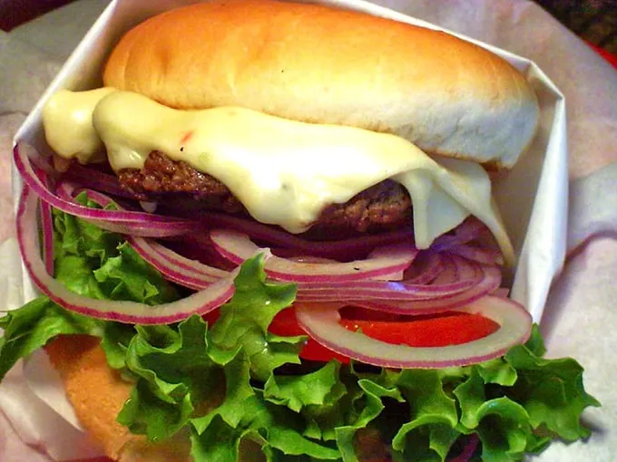 Pepper Jack perfection! This burger's got more layers than a telenovela and twice the spicy drama.