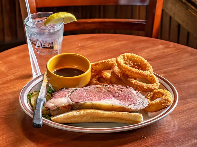 Behold the star of the show: prime rib that's more tender than a country love song. Paired with crispy onion rings, it's a match made in flavor heaven.