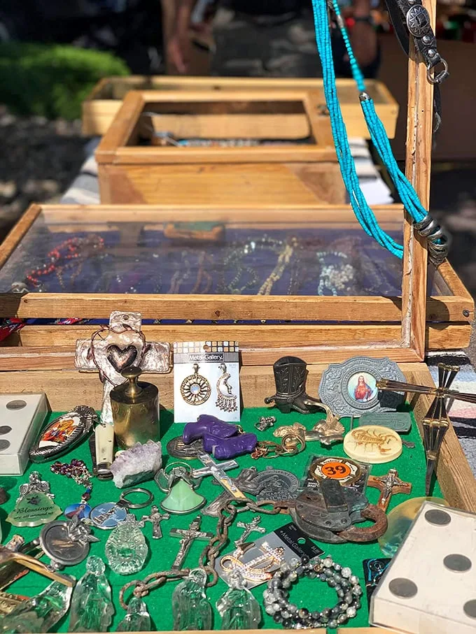 Holy moly, it's a spiritual smorgasbord! From crosses to crystals, this booth's got all your metaphysical needs covered. Talk about soul shopping!