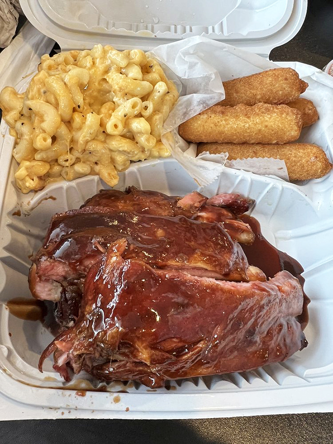 Holy smokes, Batman! This platter's not just a meal; it's a carnivore's dream come true. Mac and cheese so creamy, it could make a grown man weep.