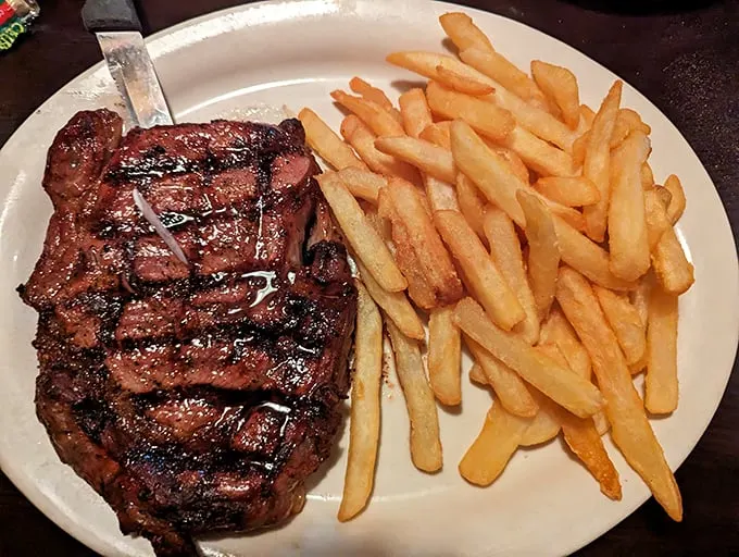 Holy cow, that's a steak! This plate could make a vegetarian question their life choices faster than you can say "medium-rare."