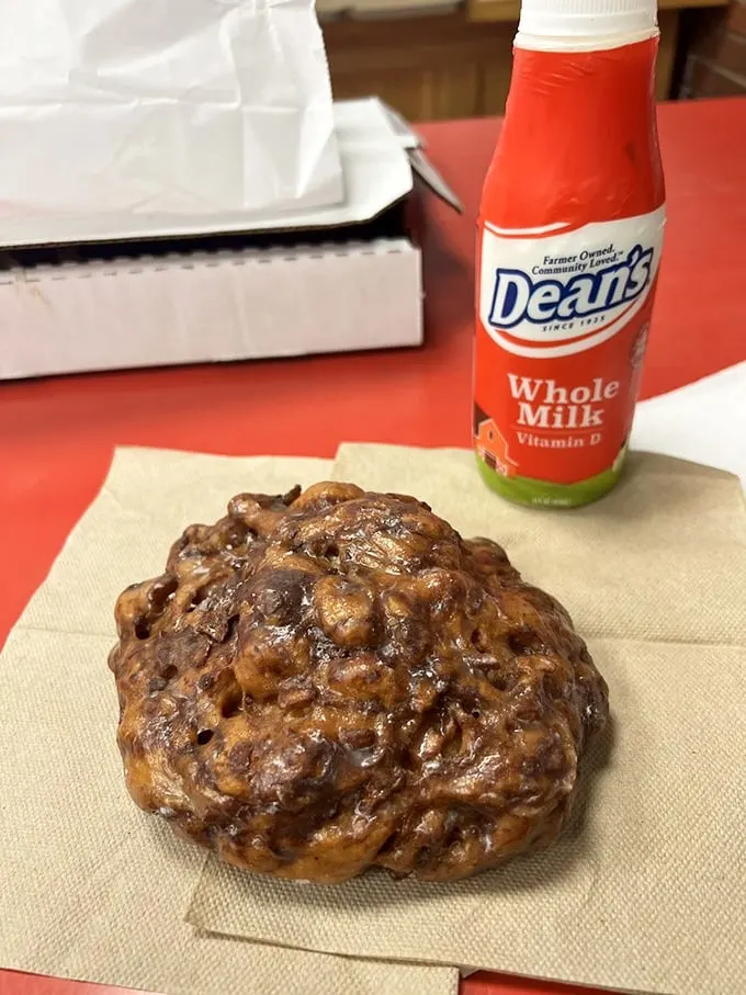 The holy grail of fried dough—a proper apple fritter paired with cold milk. This isn't breakfast; it's an edible hug for your soul.