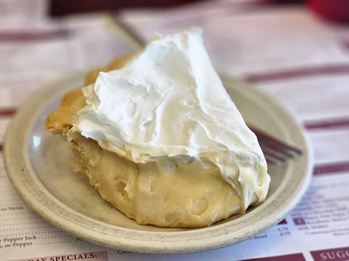 The butterscotch cream pie doesn't just have height—it has ambition, with a cloud of whipped cream that makes you wonder if calories actually count in Amish Country.