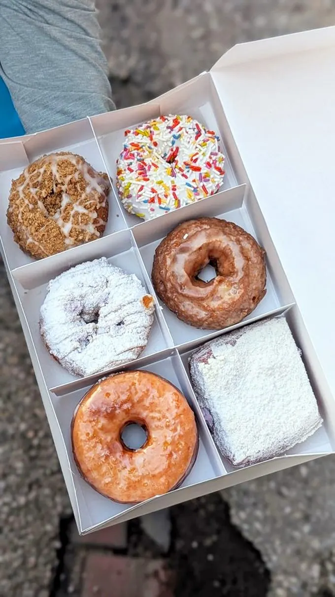A box of joy, sprinkled with happiness. These donuts aren't just a treat; they're edible art that would make Picasso proud.