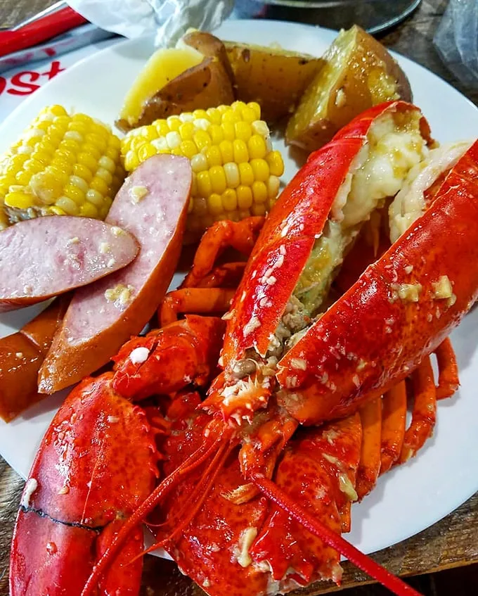 Holy crustacean! This isn't just a meal; it's a seafood spectacular. Corn, potatoes, and sausage join the party – utensils optional, bibs recommended.