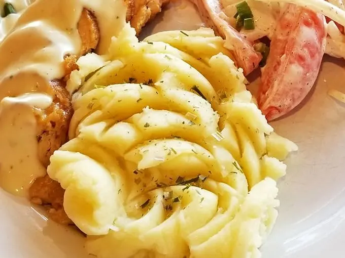 Those potatoes aren't just food—they're edible art. The sweet cheese filling and cream sauce create a symphony that would make Mozart put down his fork and applaud.