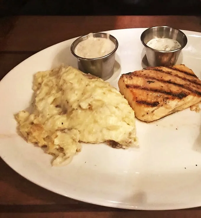 Those legendary mashed potatoes aren't just a side dish—they're the main event with supporting actors of grilled chicken and twin dipping sauces.