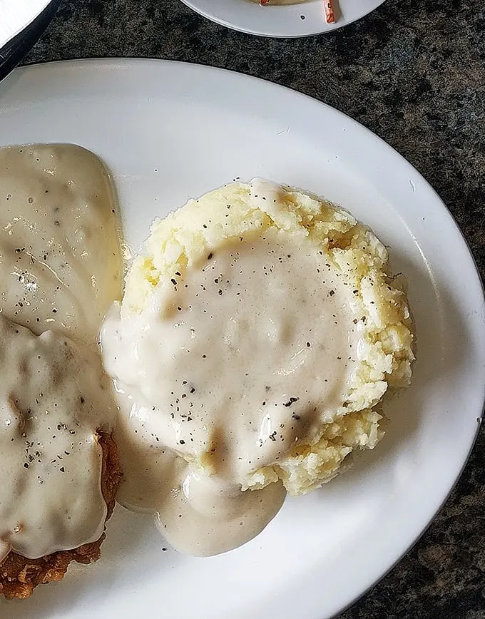 Behold: the mashed potato volcano with its gravy lava flow. Scientists should study how something so simple can trigger such profound joy.