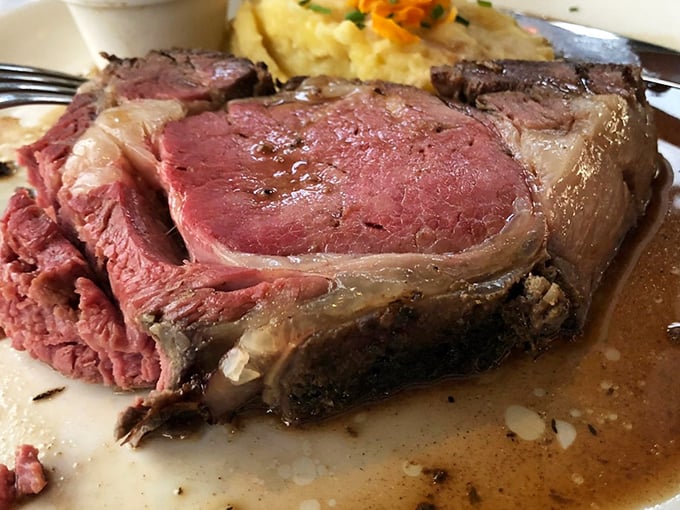 Behold the prime rib in all its glory—a perfectly rosy interior with a seasoned crust that inspires poetry and ruins lesser beef experiences forever.