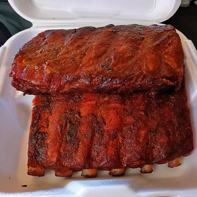 Holy smoke rings, Batman! These ribs aren't just fall-off-the-bone tender; they're practically doing the cha-cha off the plate.