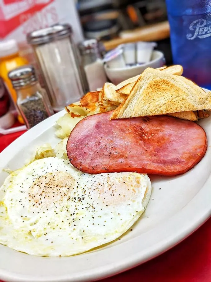 The breakfast special doesn't need fancy descriptions to make its case—perfectly cooked eggs, ham that means business, and potatoes that had a higher purpose.