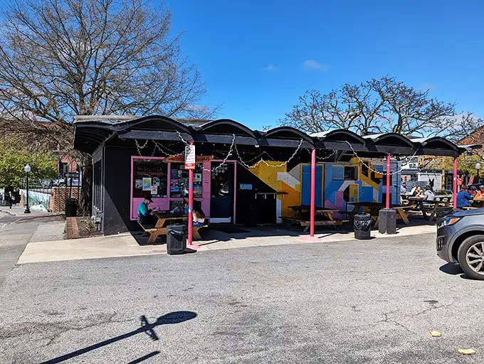 The colorful exterior murals at Benny's are like a preview of the artistic expression happening inside—except this art disappears slice by slice.