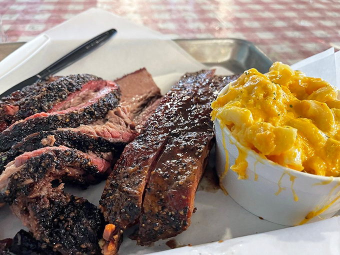 The romance between smoke and beef has produced these beautiful offspring: brisket with a crimson ring and ribs that glisten with promise.