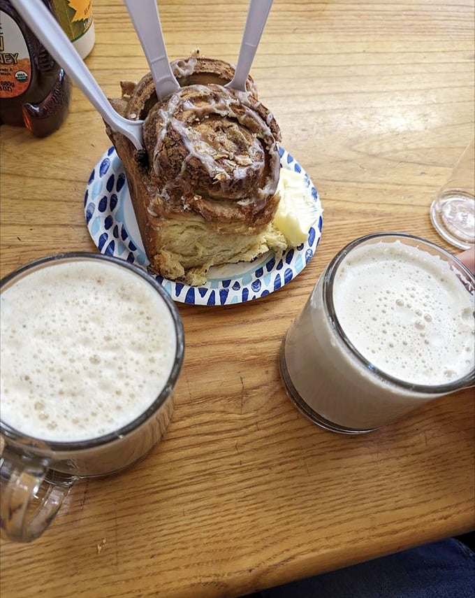 Coffee, cinnamon roll, and good company – the holy trinity of a perfect Alaskan morning. Just add a side of mountain views.