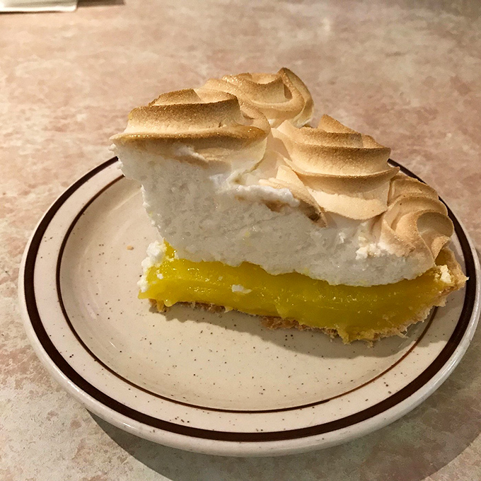 Holy meringue, Batman! This lemon meringue pie is sporting a 'do that would make Marge Simpson envious. Talk about lemon-scented cloud nine!
