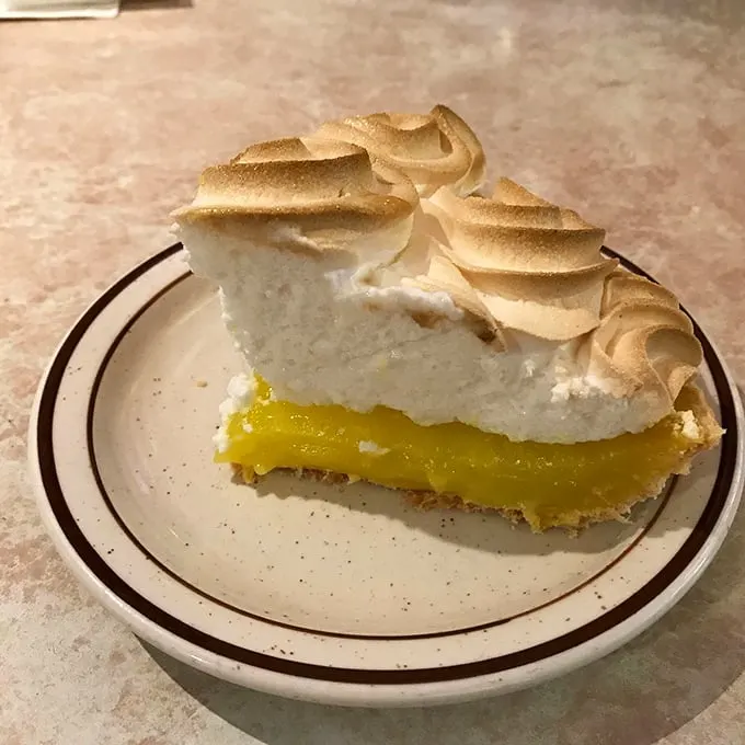 Holy meringue, Batman! This lemon meringue pie is sporting a 'do that would make Marge Simpson envious. Talk about lemon-scented cloud nine!