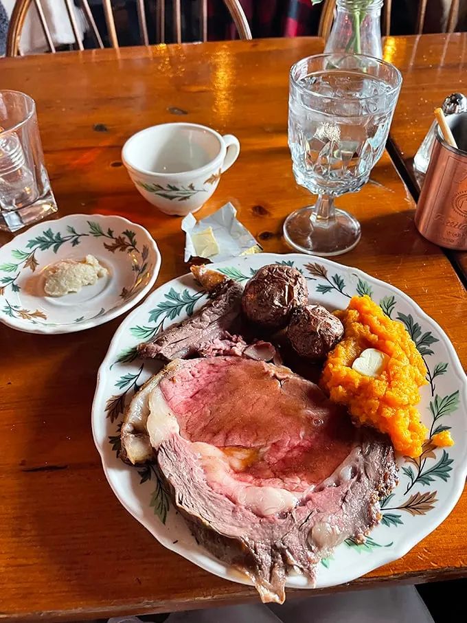A plate that screams "New England comfort" louder than a Bostonian at a Red Sox game. Prime rib, roasted veggies, and potatoes – oh my!