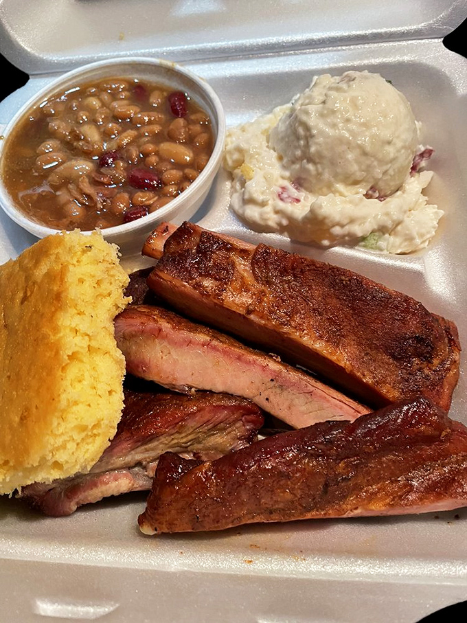 The BBQ Grand Slam! This platter is what food fantasies are made of – ribs, sides, and a cornbread so good, it should be illegal.
