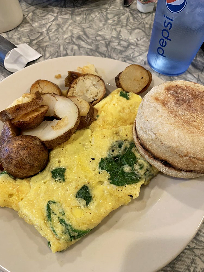 Popeye would trade his spinach for this green goddess. A spinach and cheddar omelet that'll make you stronger... and possibly late for work.