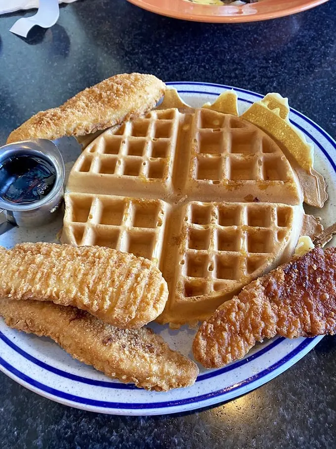 Who says you can't have it all? This waffle and fish combo is the culinary equivalent of wearing a tuxedo to the beach – unexpectedly perfect.