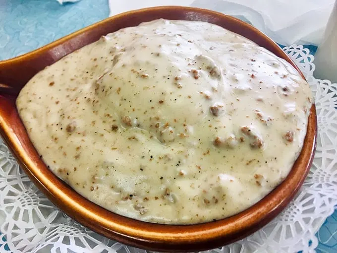 Not all heroes wear capes—some come in ceramic bowls, smothered in peppery gravy, ready to rescue you from hunger with country-style comfort.