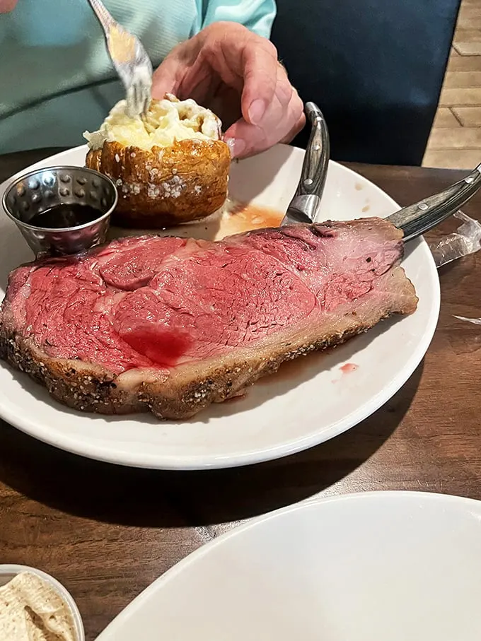 The classic prime rib: where 'medium-rare' meets 'medium-amazing'. This plate is a testament to the art of perfect timing and seasoning.