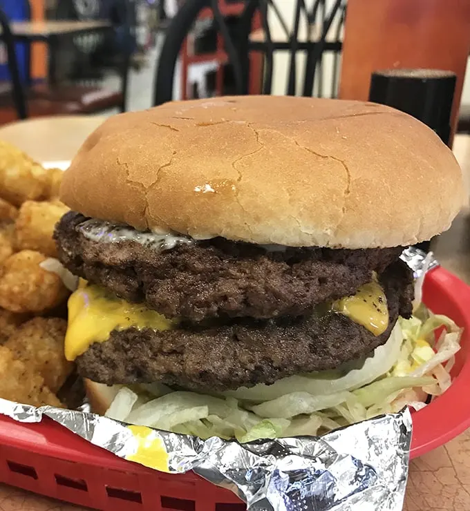 Double the patty, double the fun! This towering creation is the Everest of burgers - a challenge worth accepting.