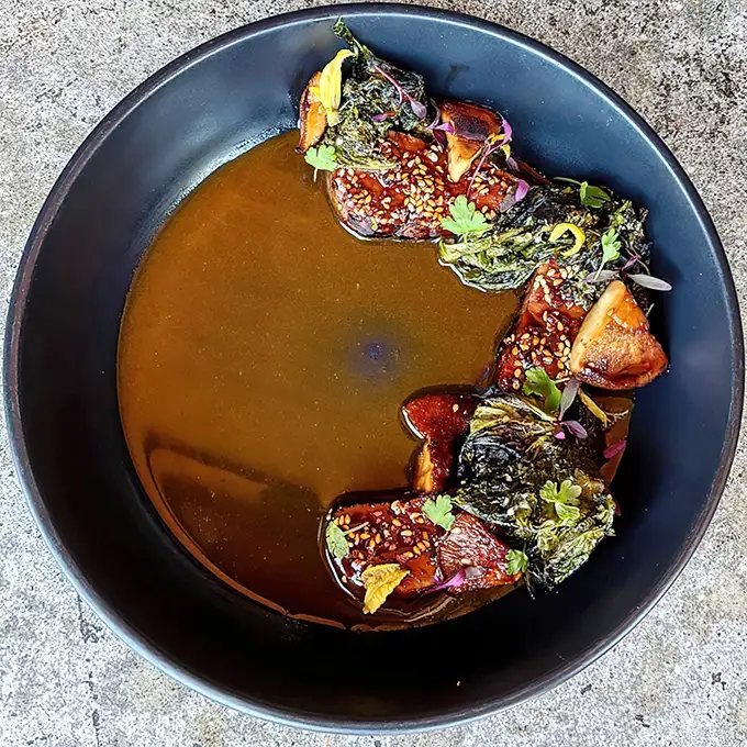Another bowl of umami heaven – these tender pieces of pork nestled in broth remind us why "soup" is too simple a word here.